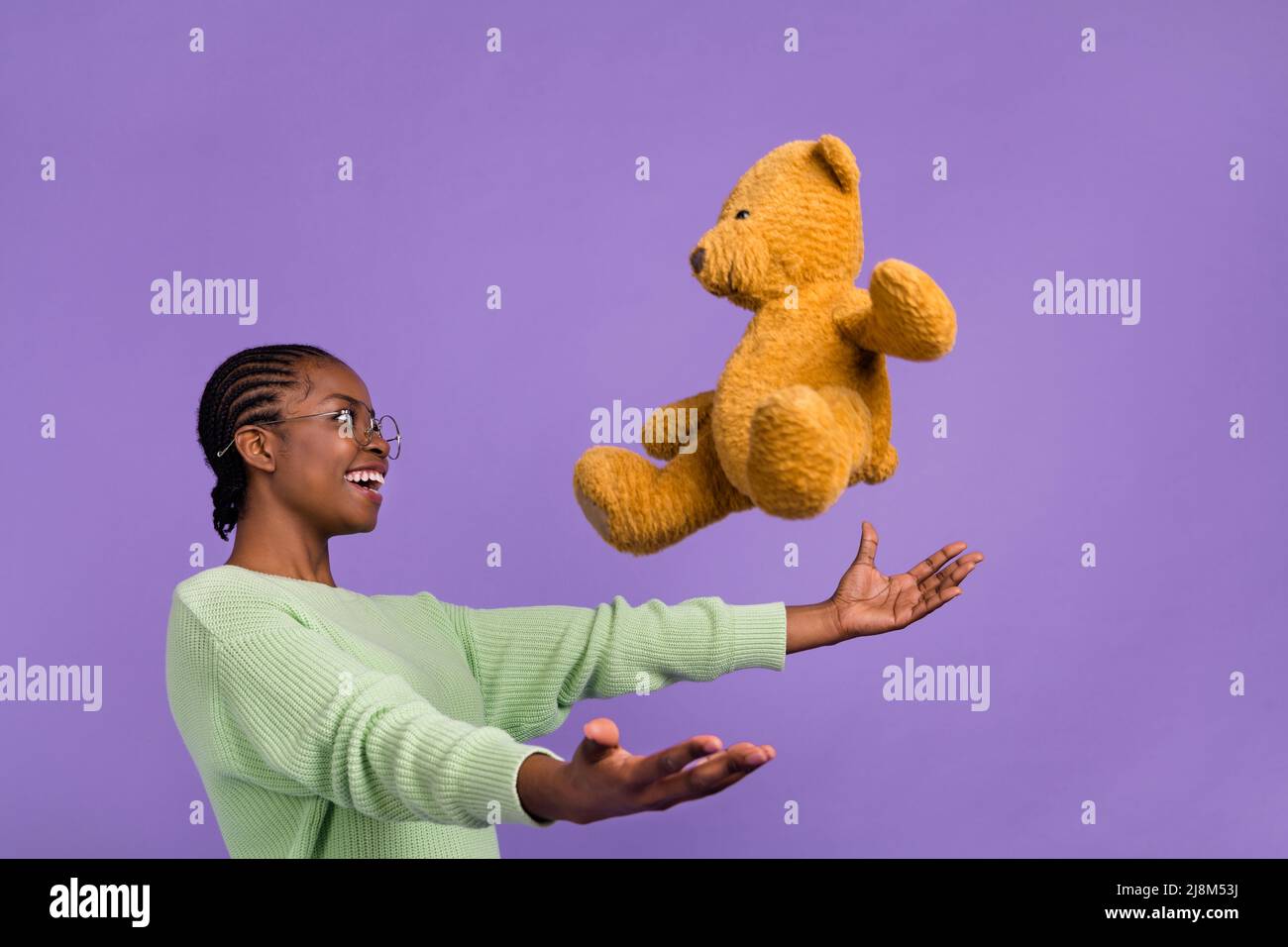 Profile side picture of overjoyed excited lady catching cute plushie ...