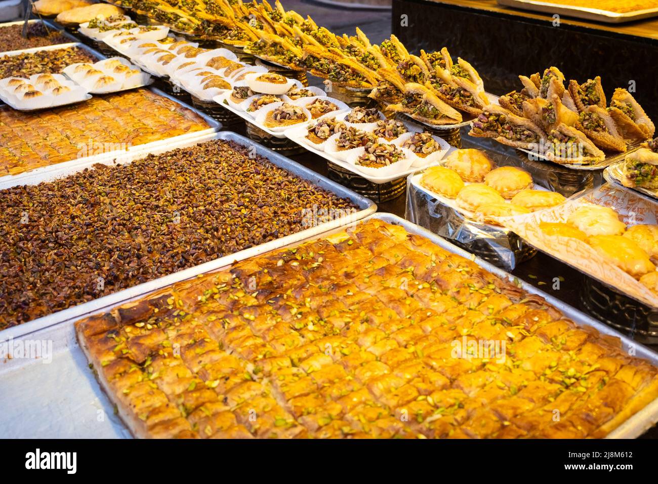 variety of arabic sweets and dessert, baklava in pastry and bakery shop ...