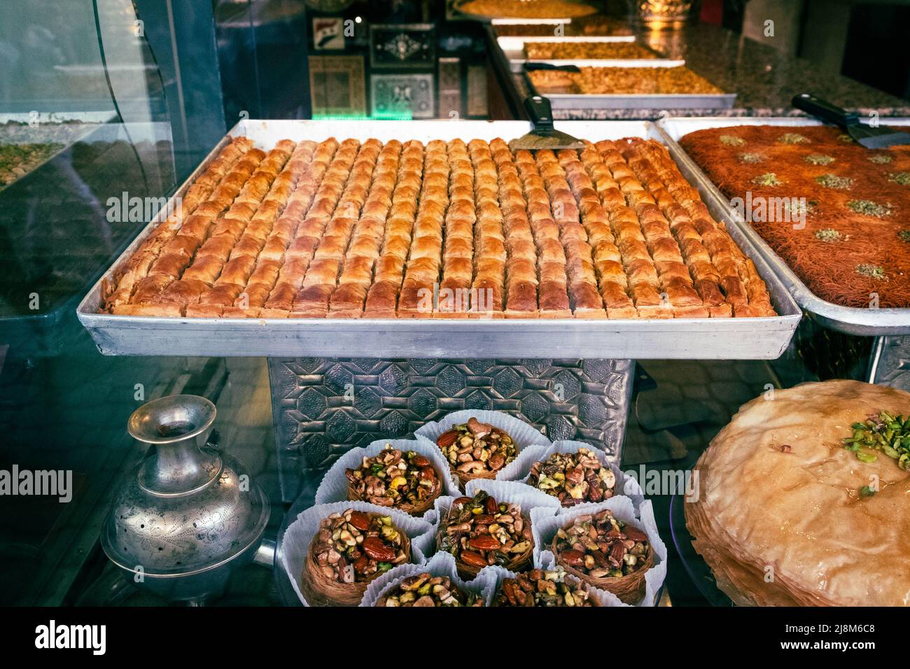 variety of arabic sweets and dessert, baklava in pastry and bakery shop ...