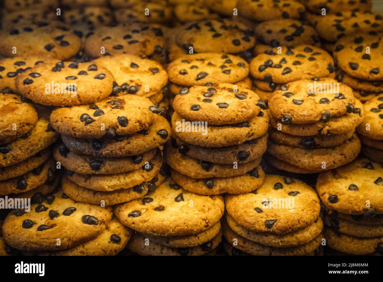 Pile of chocolate cookies in bakery display Stock Photo - Alamy