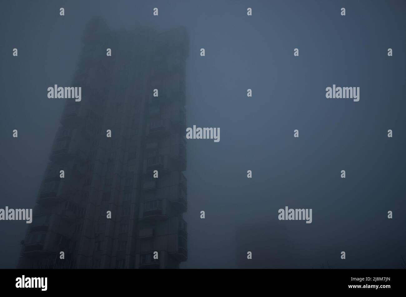 Two tall residential buildings in the form of a tower, immersed in a ...