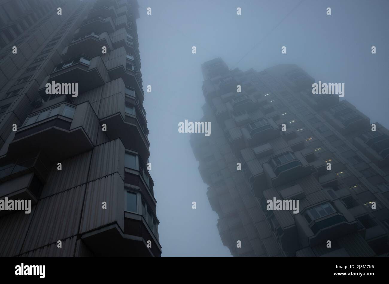 Two tall residential buildings in the form of a tower, immersed in a ...