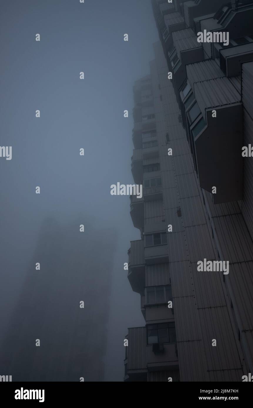 Two tall residential buildings in the form of a tower, immersed in a ...