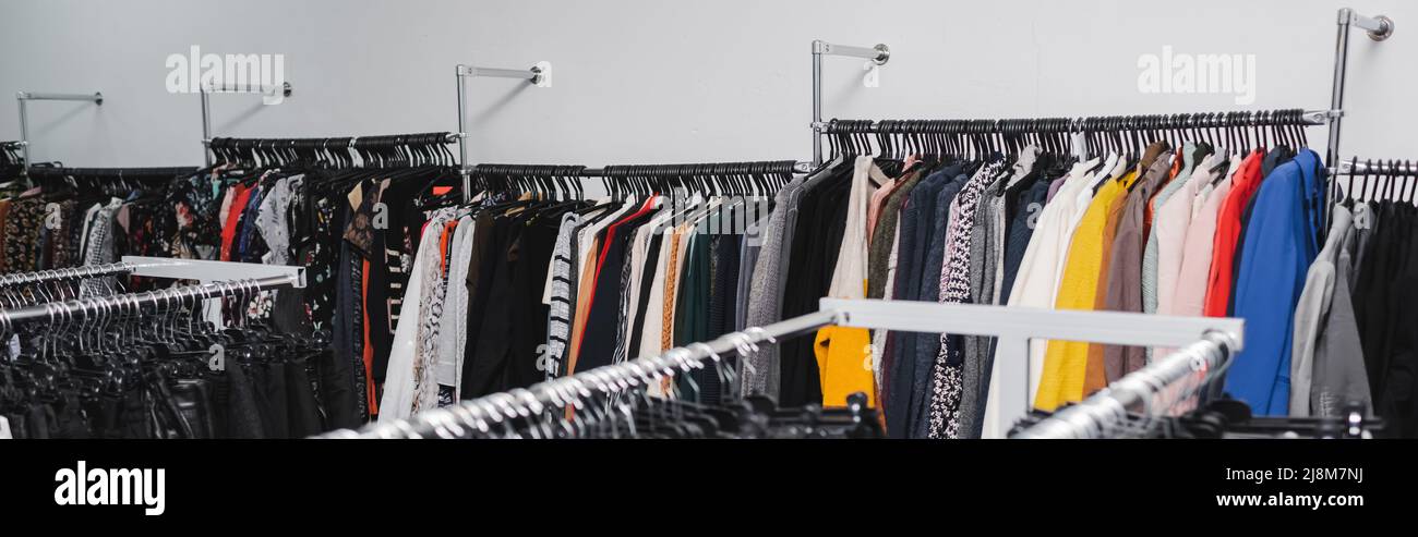 Vintage clothing on hangers in vintage shop, banner Stock Photo - Alamy