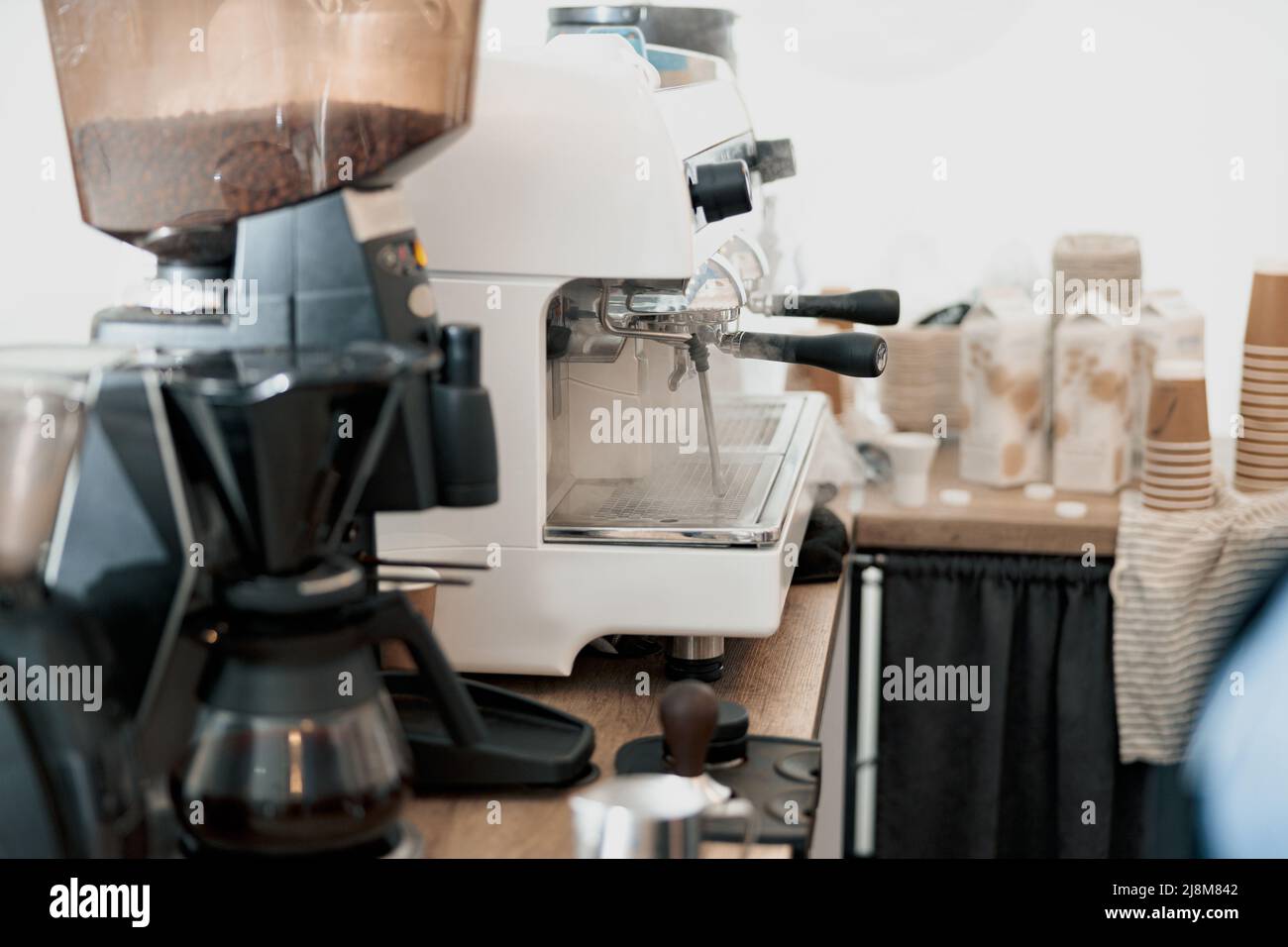 Professional modern coffee machine on counter in cafeteria Stock Photo ...