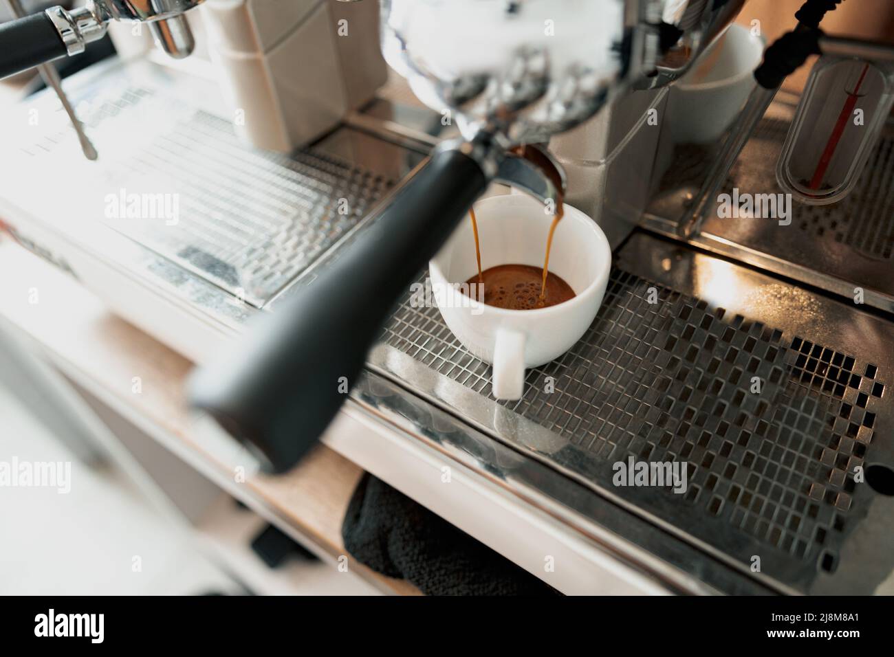 Professional coffee machine brewing coffee in cafeteria Stock Photo - Alamy