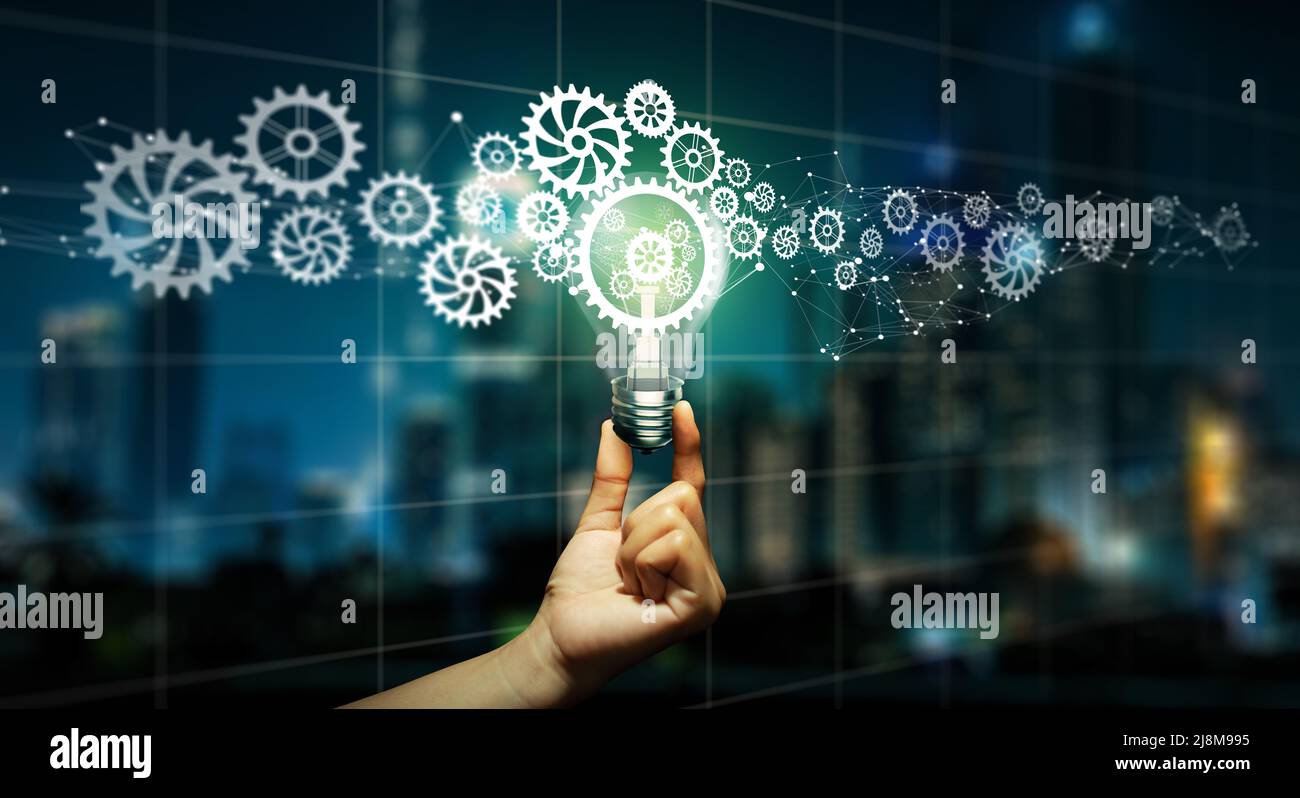 Businessman hand holding light bulb with cog inside. Business idea bulb ...