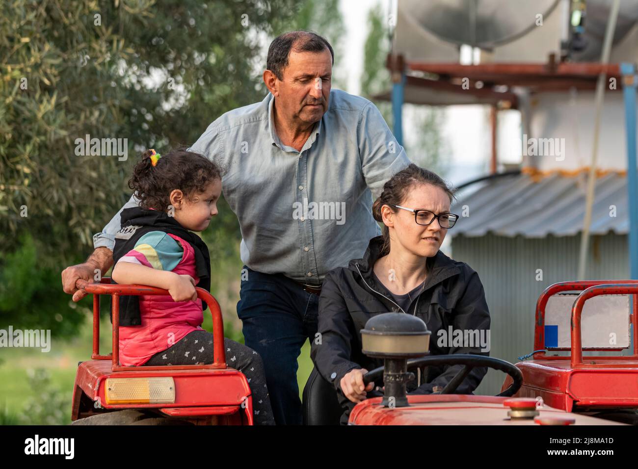 Farmer daughter on tractor hi-res stock photography and images - Alamy