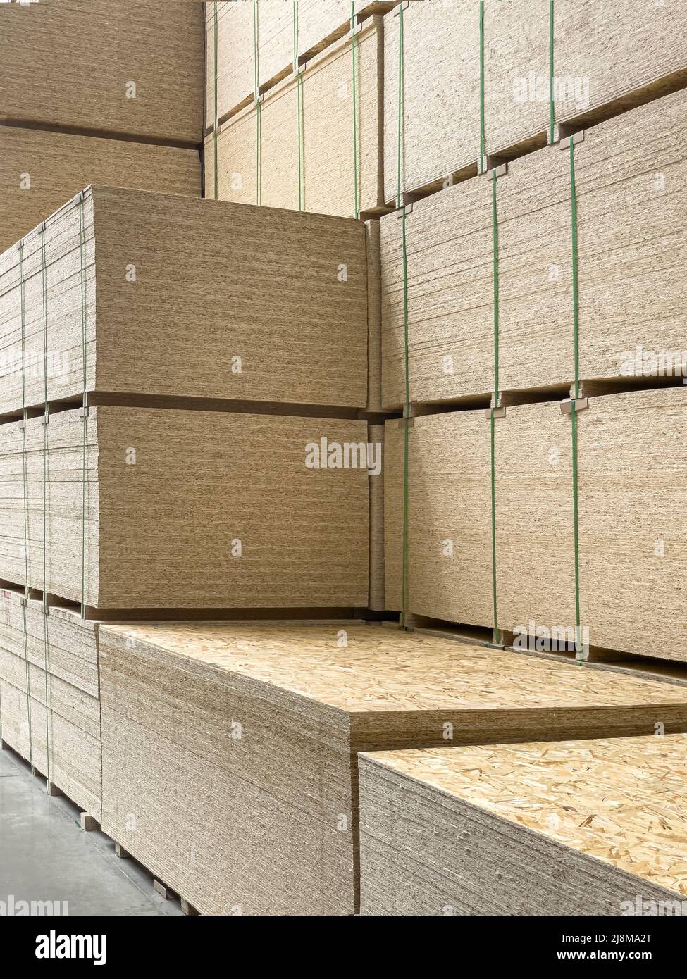 Sheet stack in a construction store. Engineered wood product for load ...
