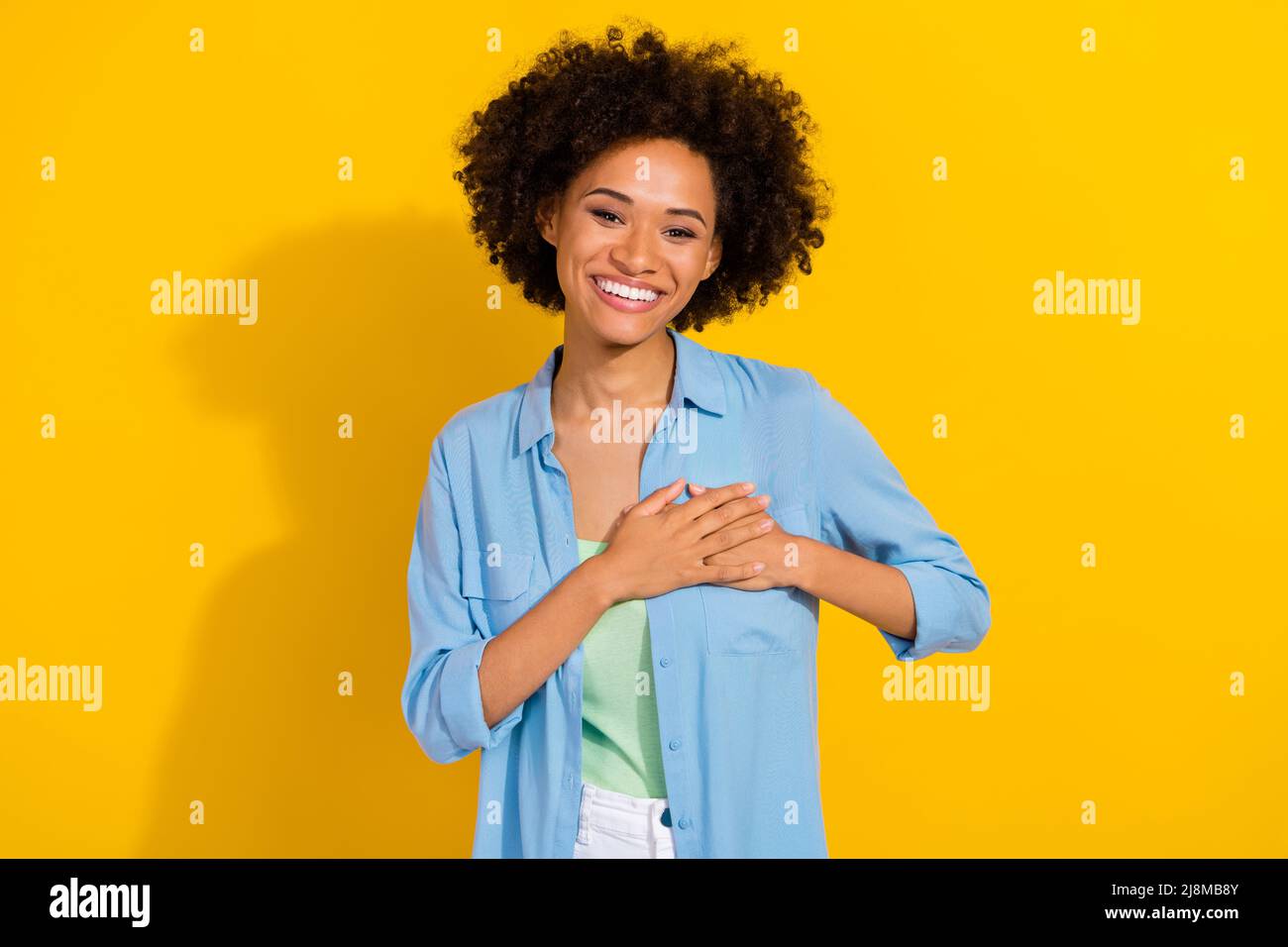 Photo of romantic affectionate lady hands touch heart chest wear jeans ...