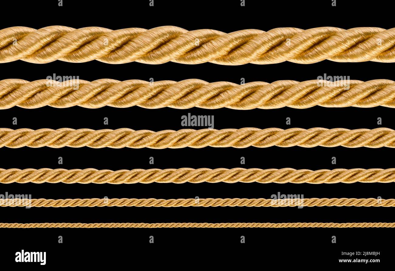 collection of various golden ropes string on black background Stock ...