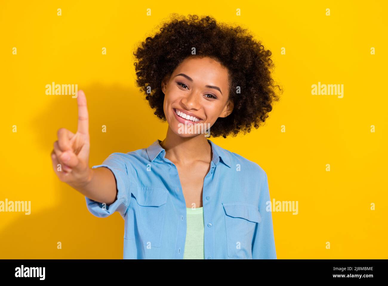 Photo of confident cheerful lady show one finger teaching concept wear ...