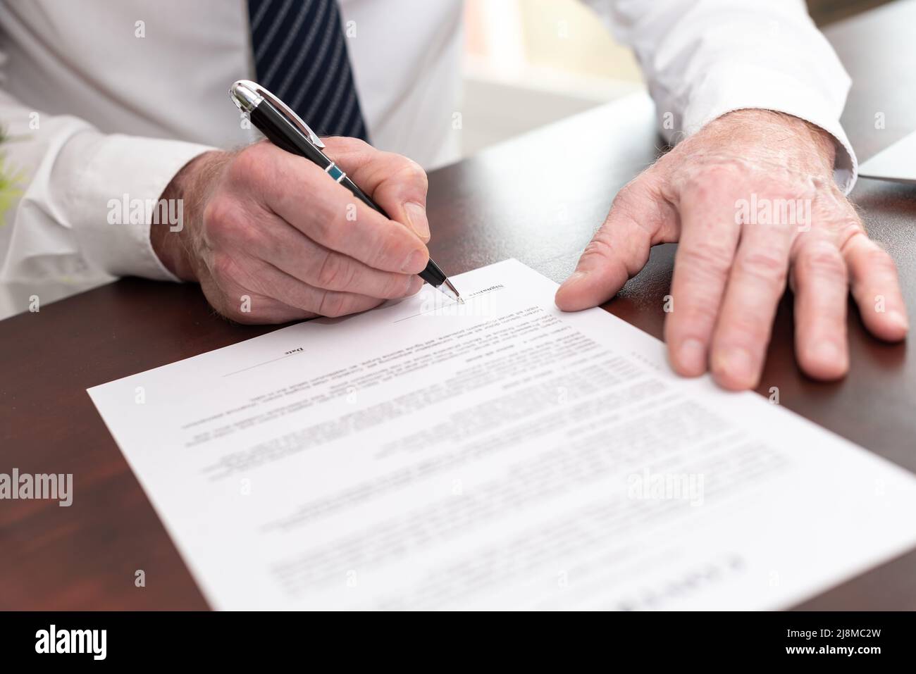 Hand of businessman signing a contract (Lorem ipsum text used Stock ...