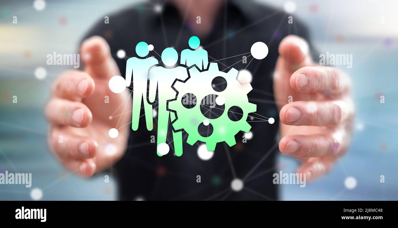 Hrm concept between hands of a man in background Stock Photo - Alamy