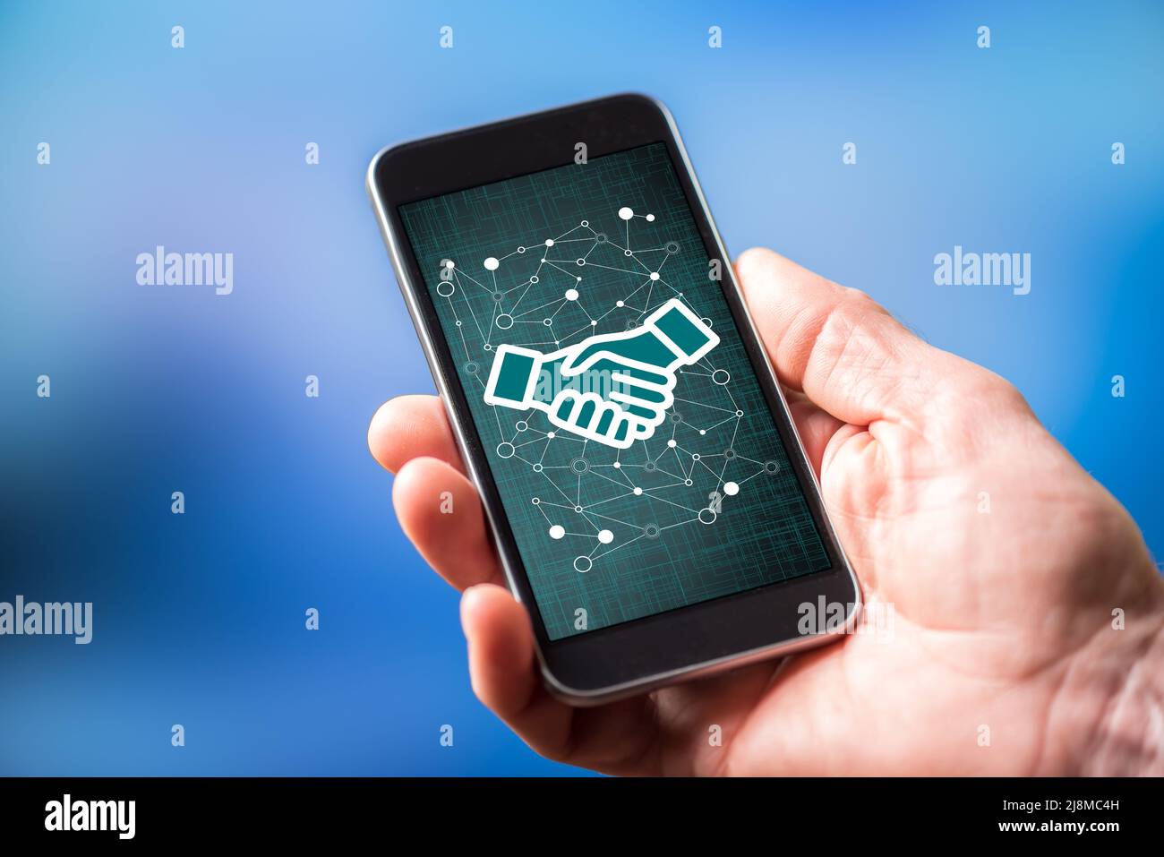 Smartphone screen displaying a business partnership concept Stock Photo ...