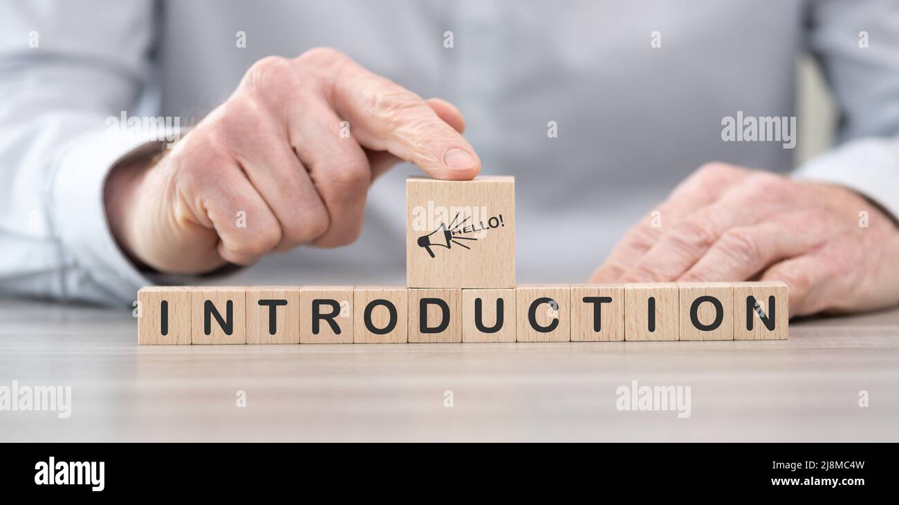 Wooden blocks with symbol of introduction concept Stock Photo - Alamy