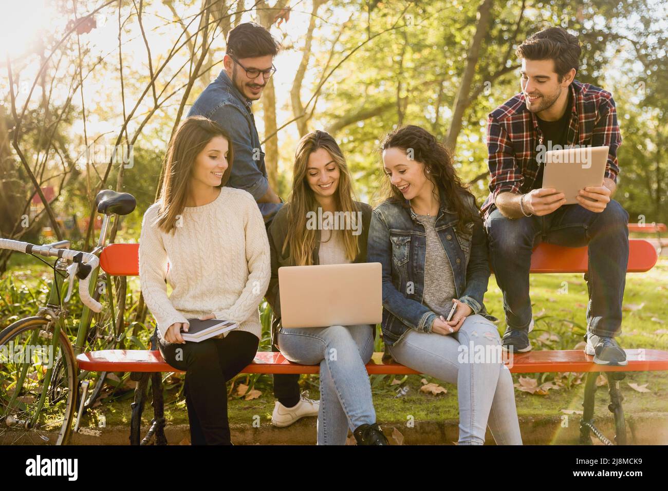 Group of friends in the park having fun together Stock Photo - Alamy