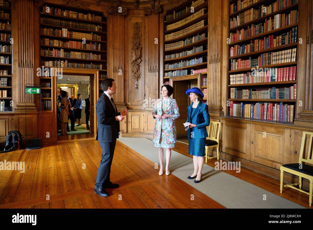 Jenni Haukio and Queen Silvia with Palace Librarian Arvid Jakobsson in ...