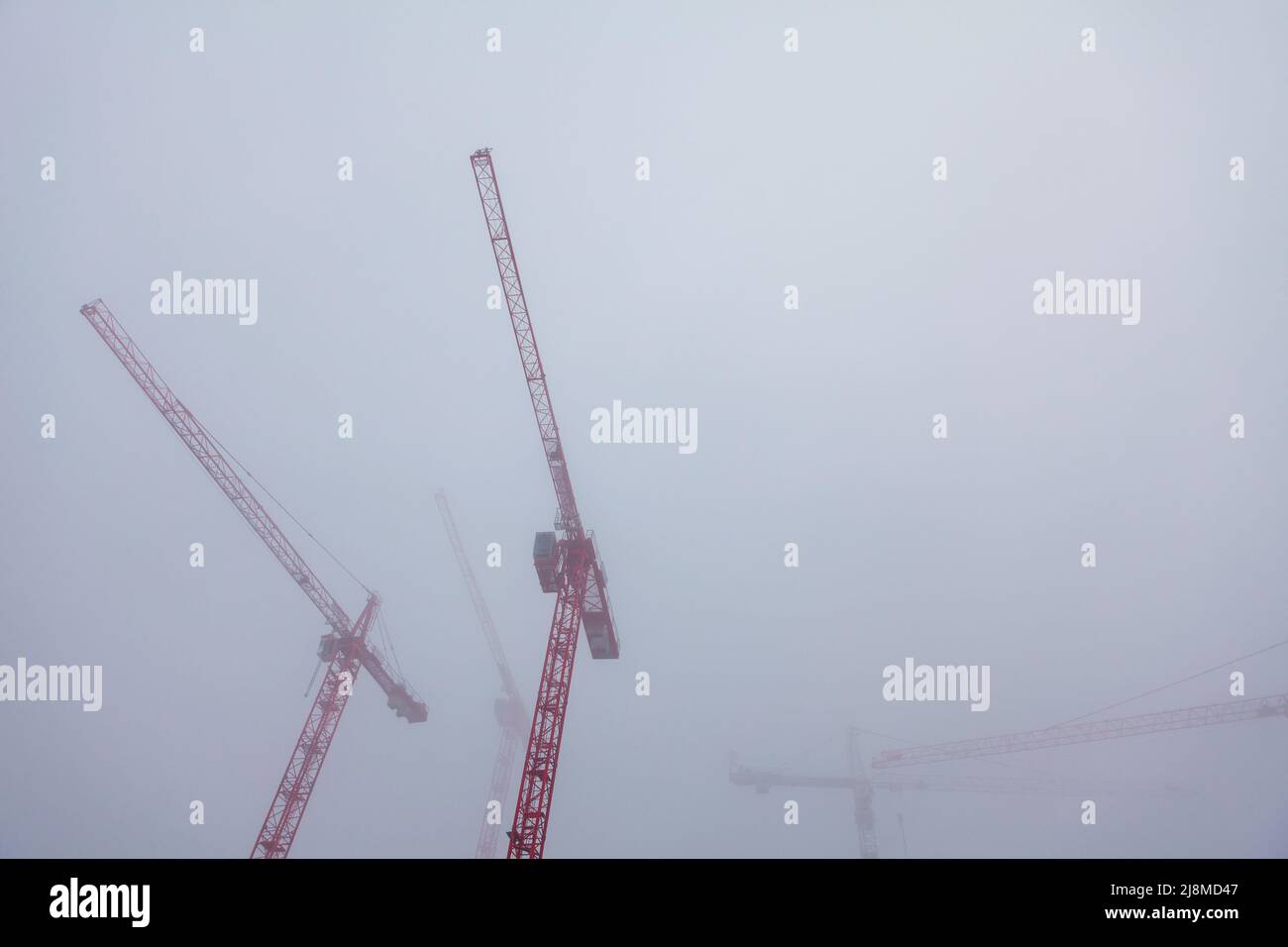 Construction site in the haze . Construction Cranes in the Fog Stock ...
