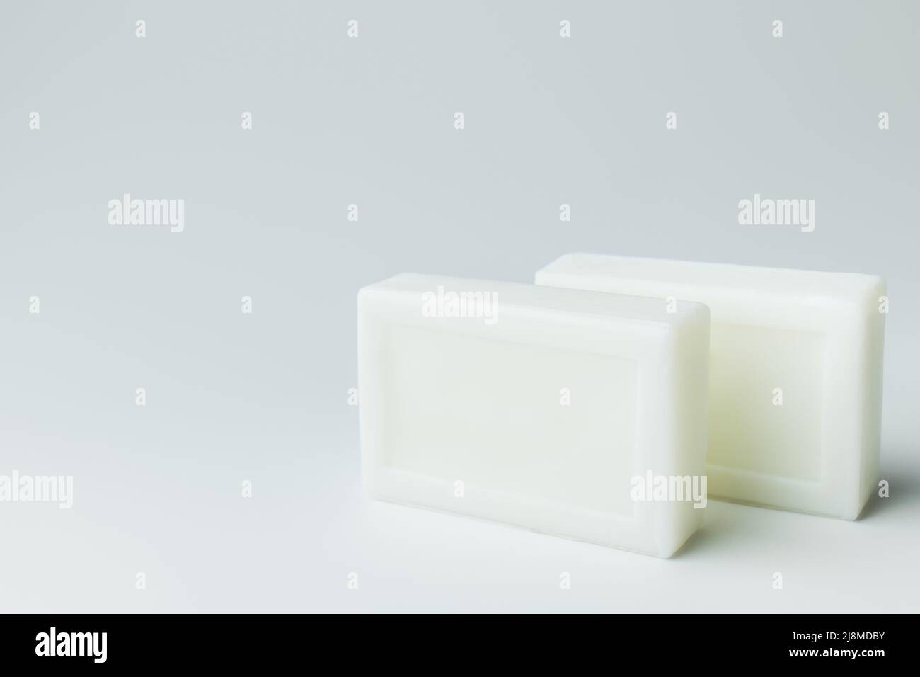white toilet soap bars on grey background Stock Photo - Alamy