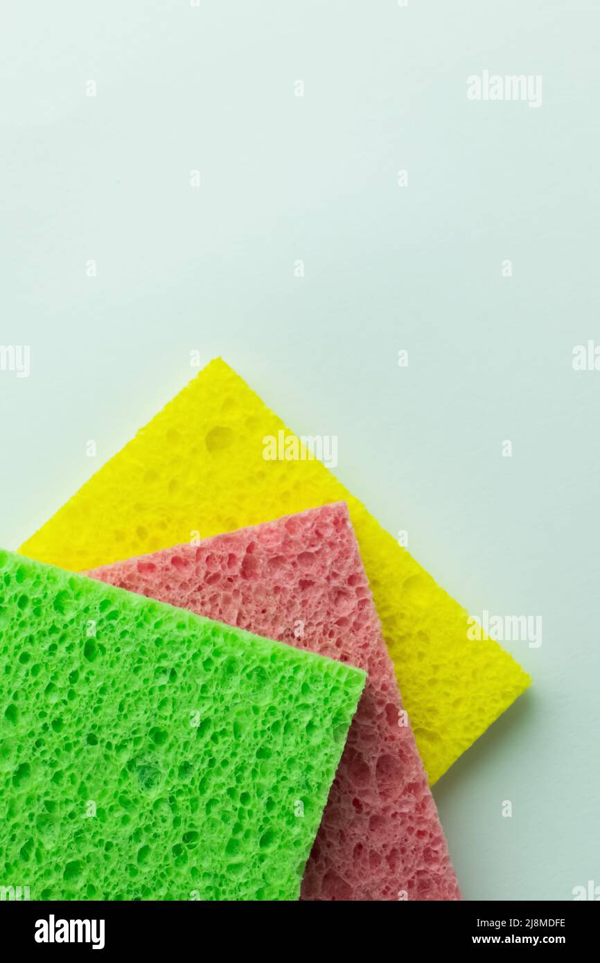 top view of textured colorful sponge cloths on grey background Stock ...