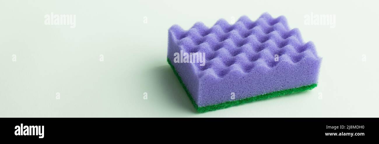 textured purple kitchen sponge on grey background, banner Stock Photo ...