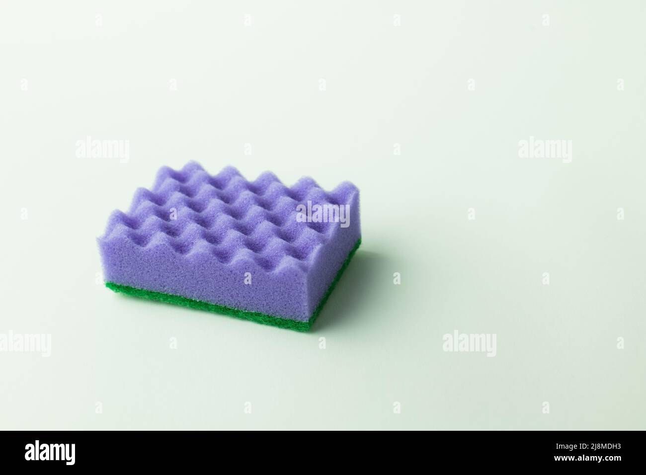 bright purple textured sponge scourer on grey background Stock Photo ...