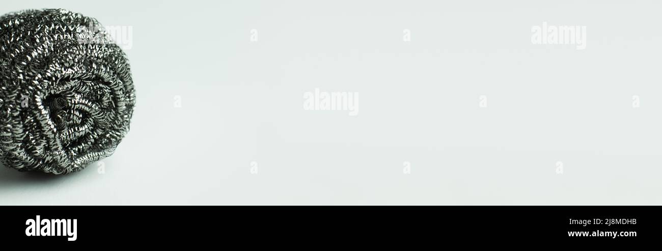 top view of steel wire scourer on grey background with copy space ...