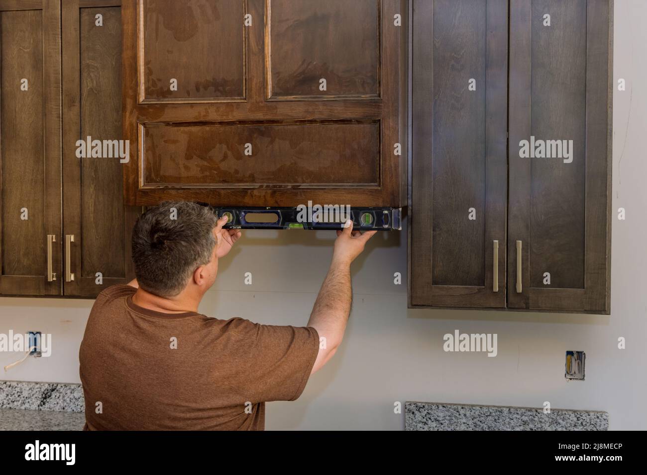 Leveling cabinet furniture for Installation of kitchen in a new house ...