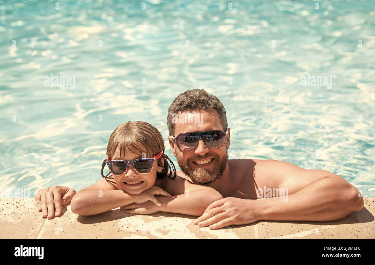 happy family of dad and small boy having fun in summer swimming pool ...
