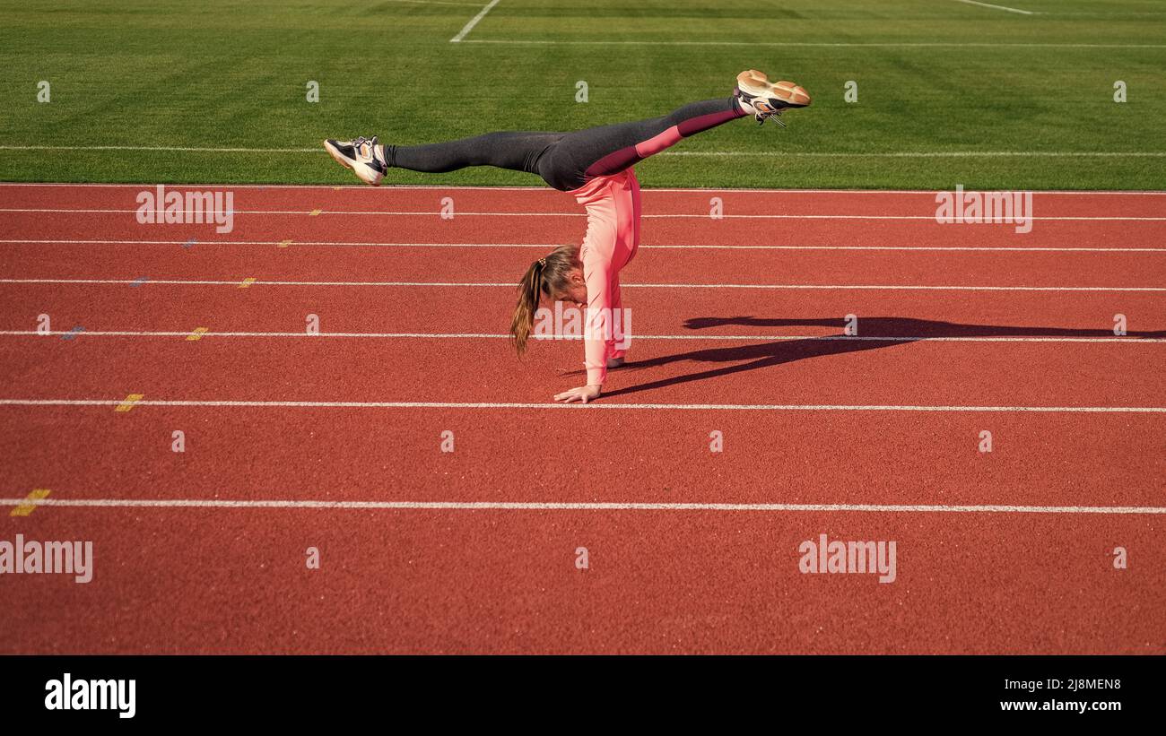 There is always a new trick to learn. Girl do handstand with legs in ... There is always a new trick to learn. Girl do handstand with legs in ...