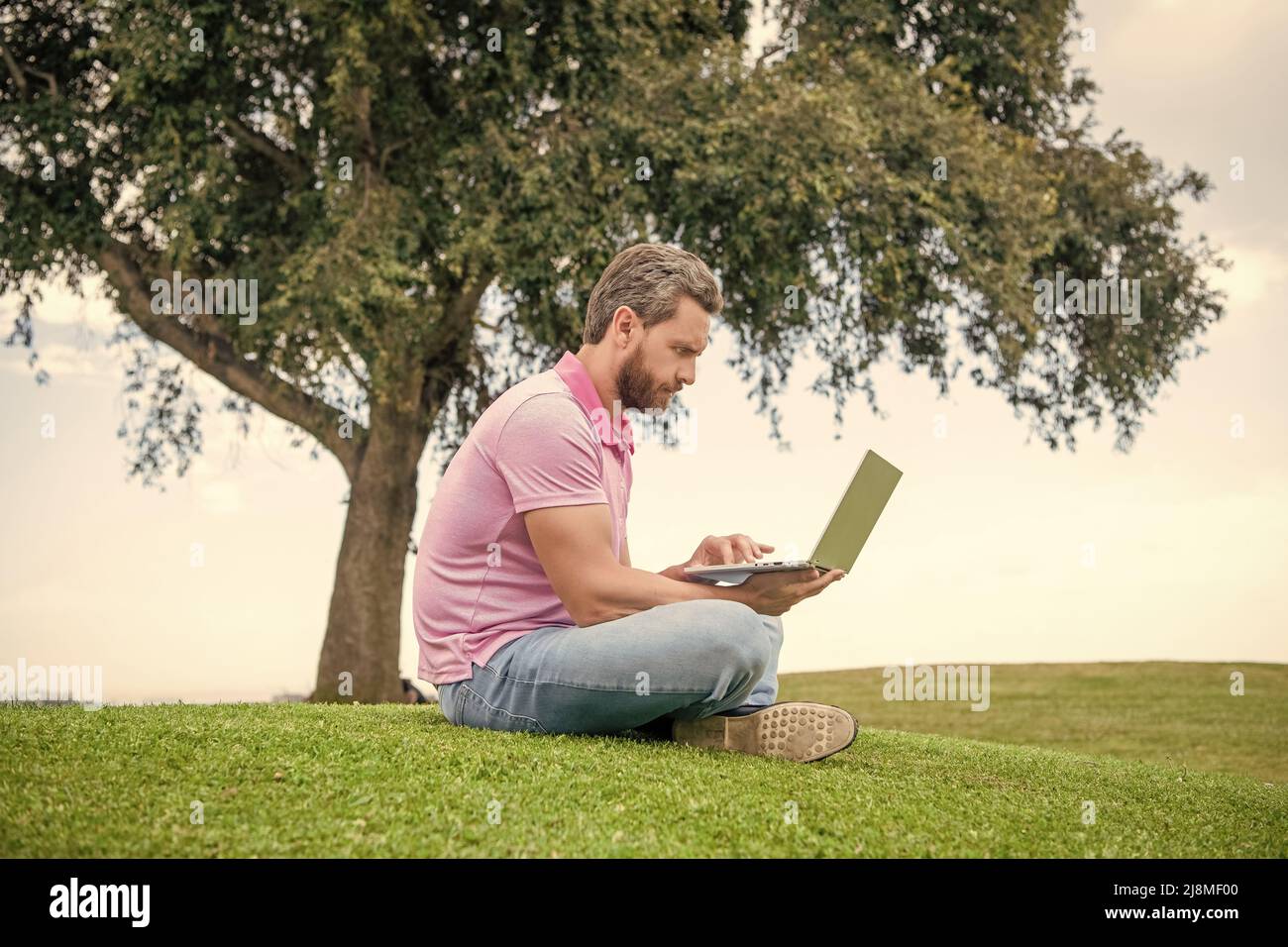 modern business computer communication. mature guy check email ...