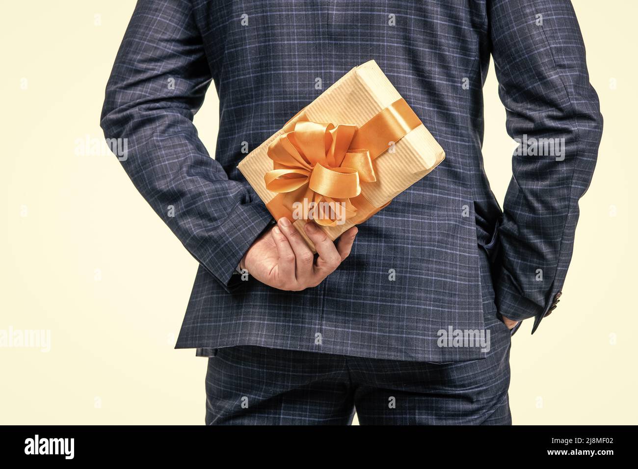 cropped businessman man hiding present box, back view, shopping Stock ...