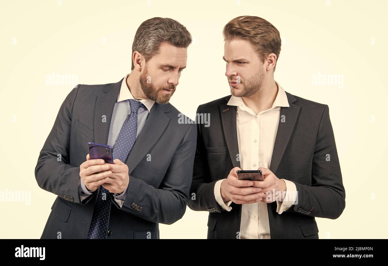 two business colleagues in suit use phone for negotiation isolated on ...