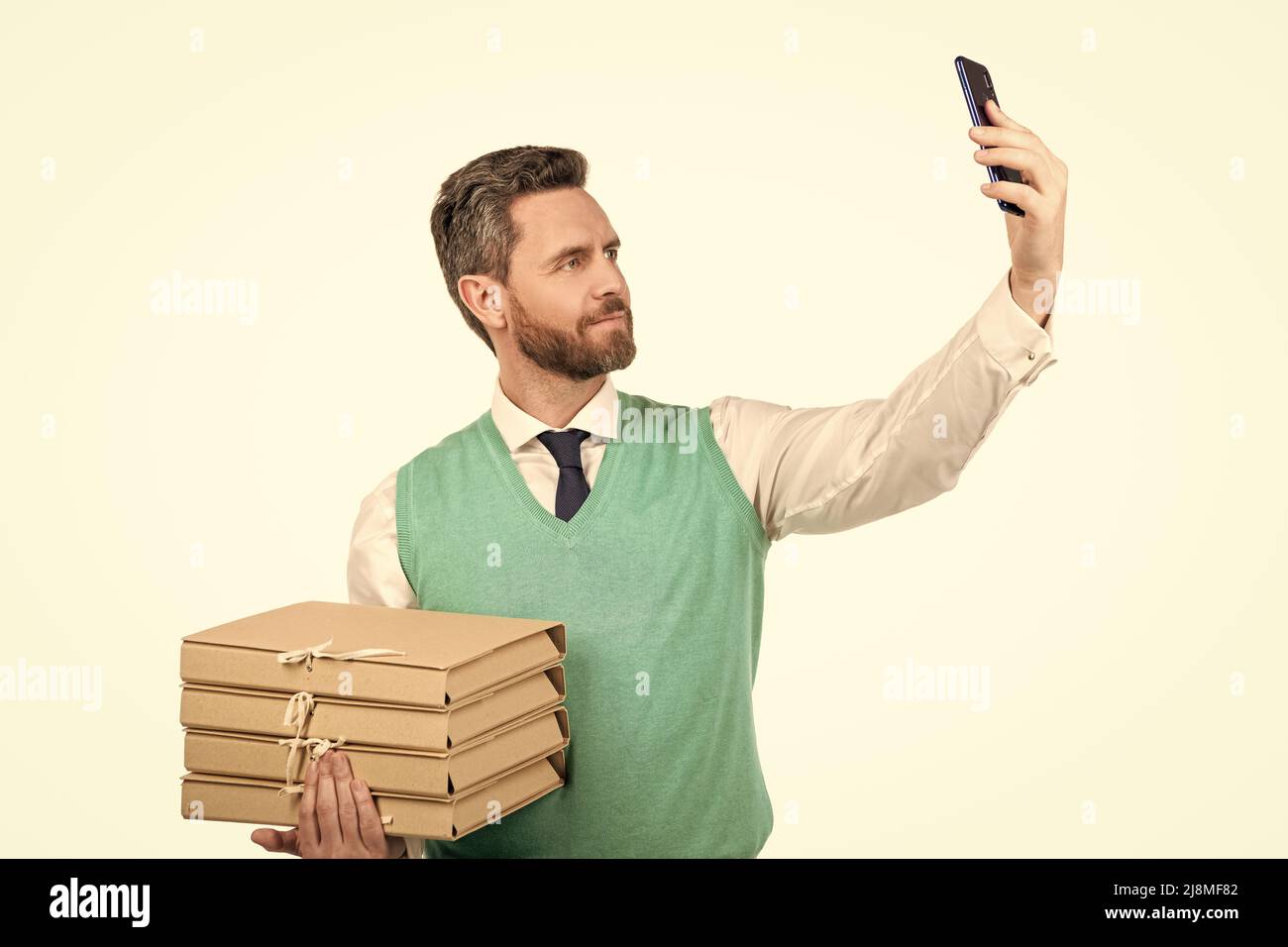handsome man manager hold heap of folder with documents making selfie ...