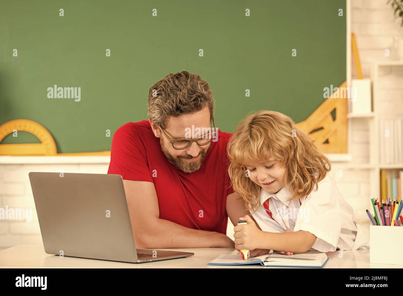 father and child study in classroom with laptop, knowledge Stock Photo ...