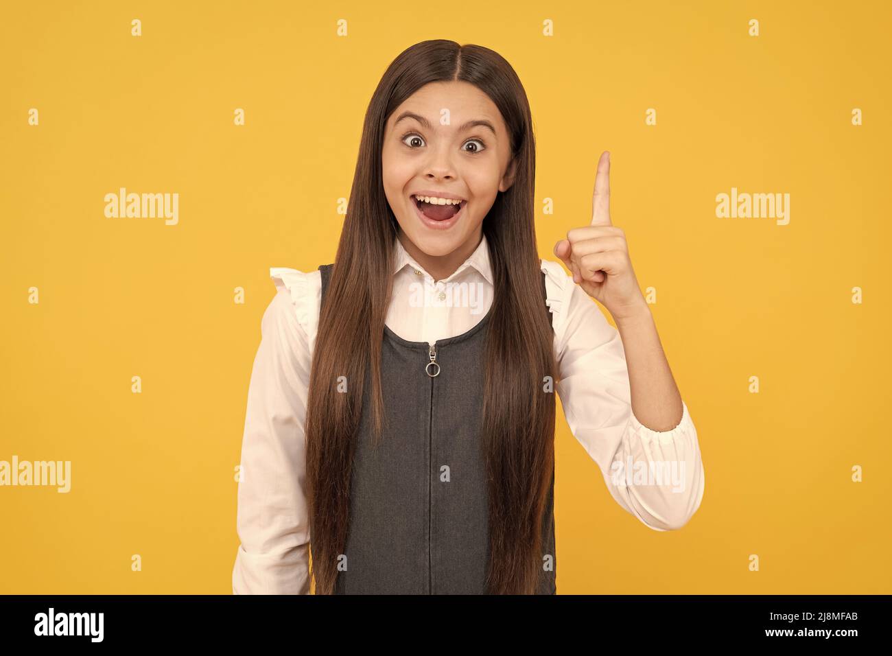 Got idea. Happy kid keep finger up yellow background. Idea. Eureka ...