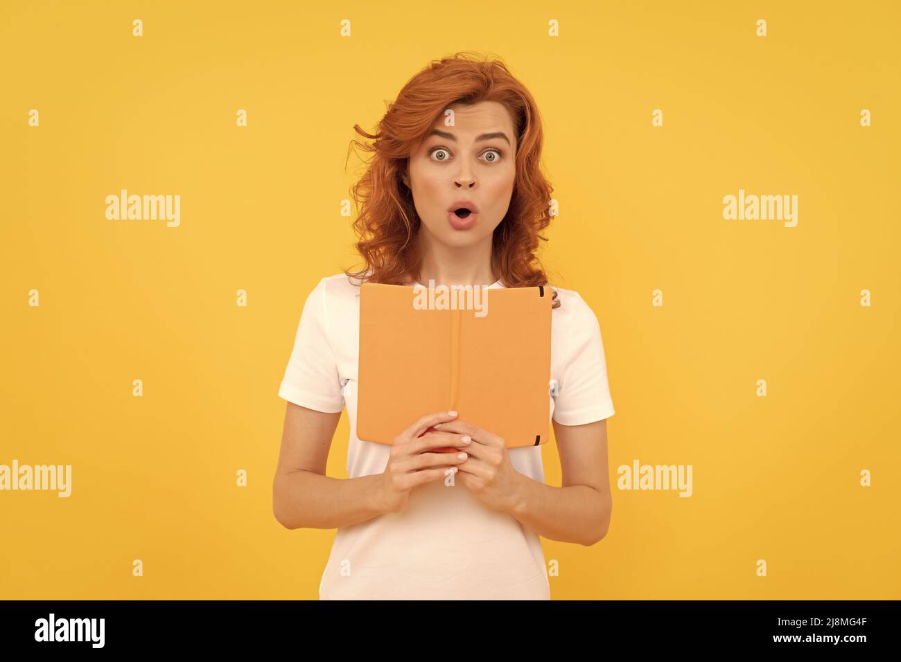 woman reader reading. shocked student on yellow background. girl study ...