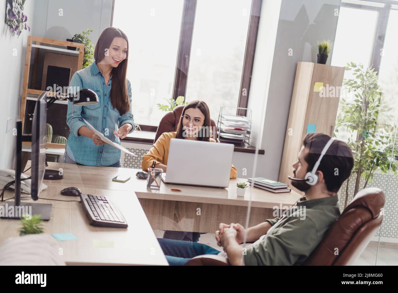 Photo of three staff members partners communicate conversation office ...
