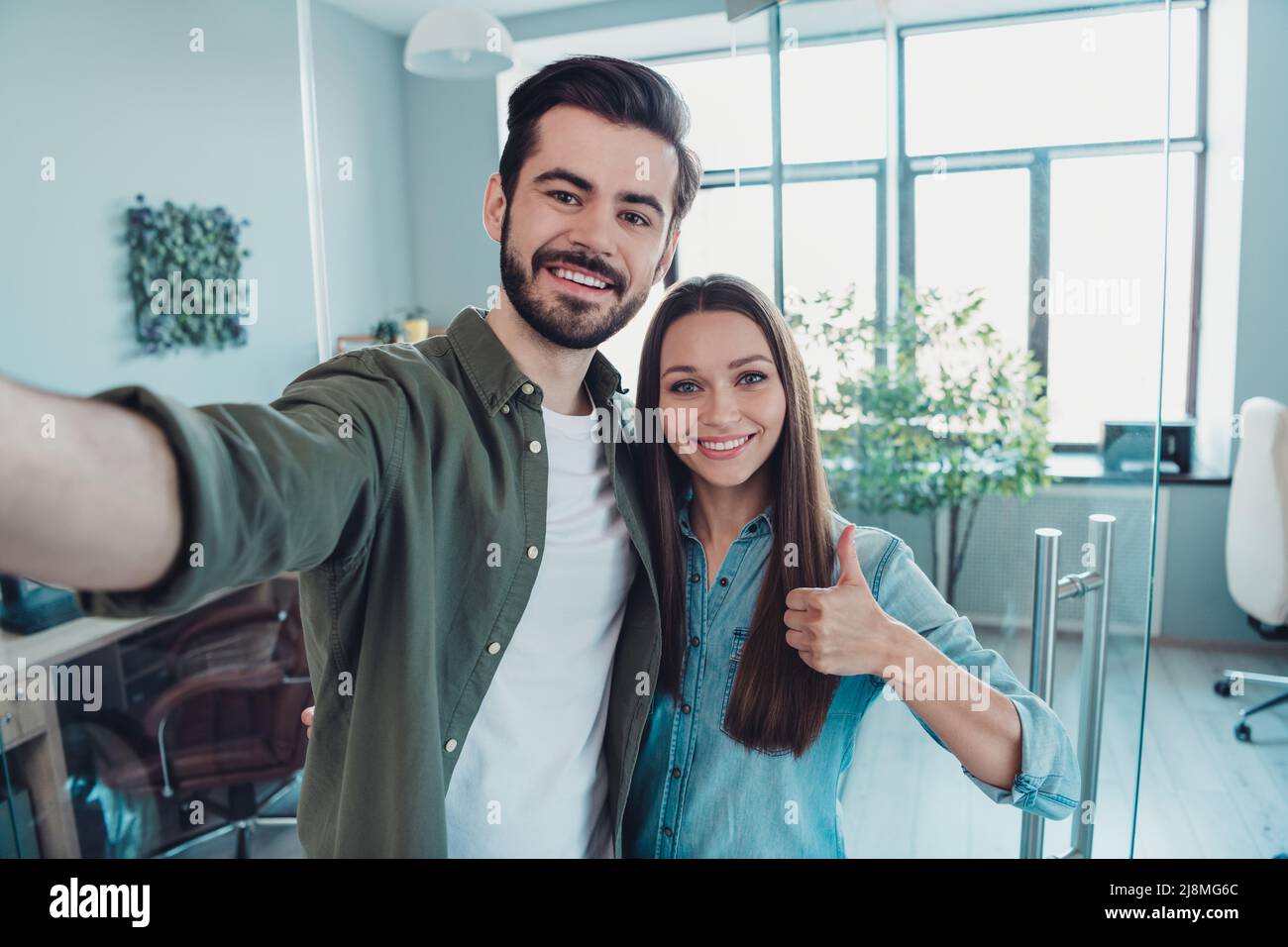 Self-portrait of two attractive cheerful friends friendship hugging ...