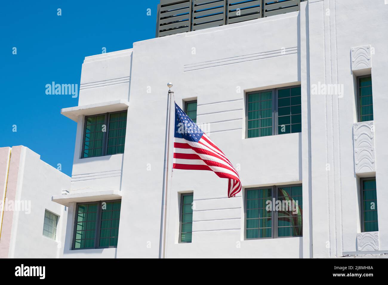 usa national flag at white building. independence day Stock Photo - Alamy