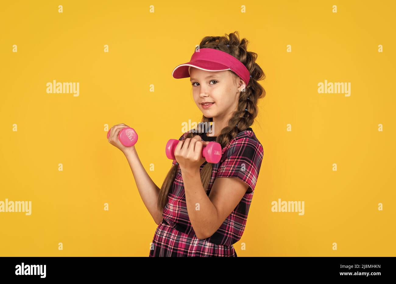 healthy sporty tween girl hold barbells, workout Stock Photo - Alamy