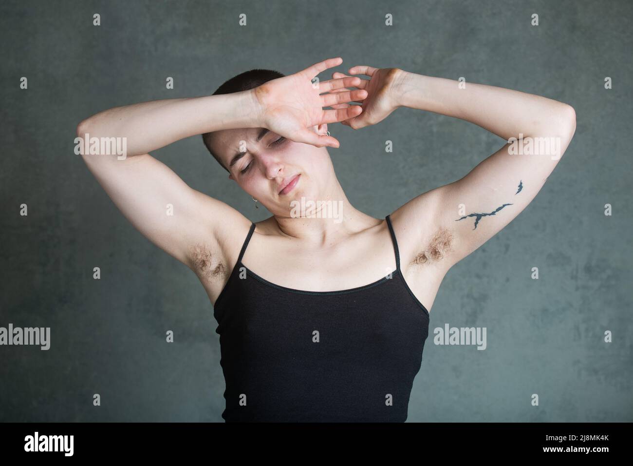 non binary pulling an angry, frustrated face Stock Photo - Alamy