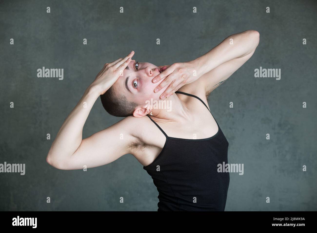 non binary pulling an angry, frustrated face Stock Photo - Alamy