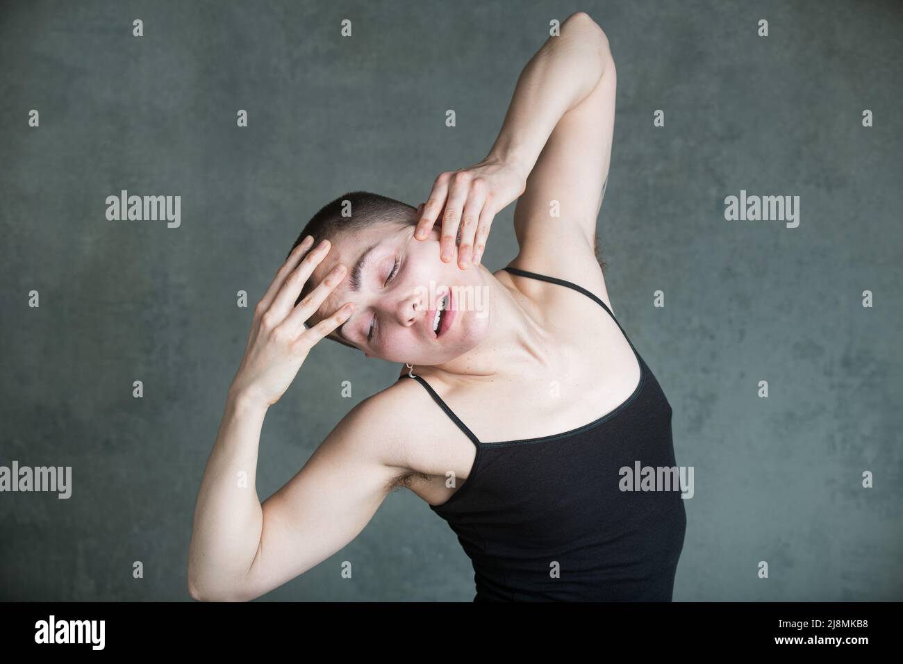 non binary pulling an angry, frustrated face Stock Photo - Alamy