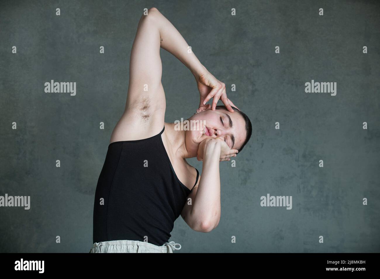 non binary pulling an angry, frustrated face Stock Photo - Alamy