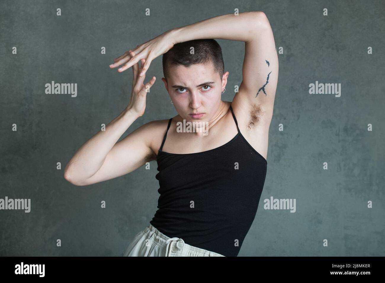 non binary pulling an angry, frustrated face Stock Photo - Alamy