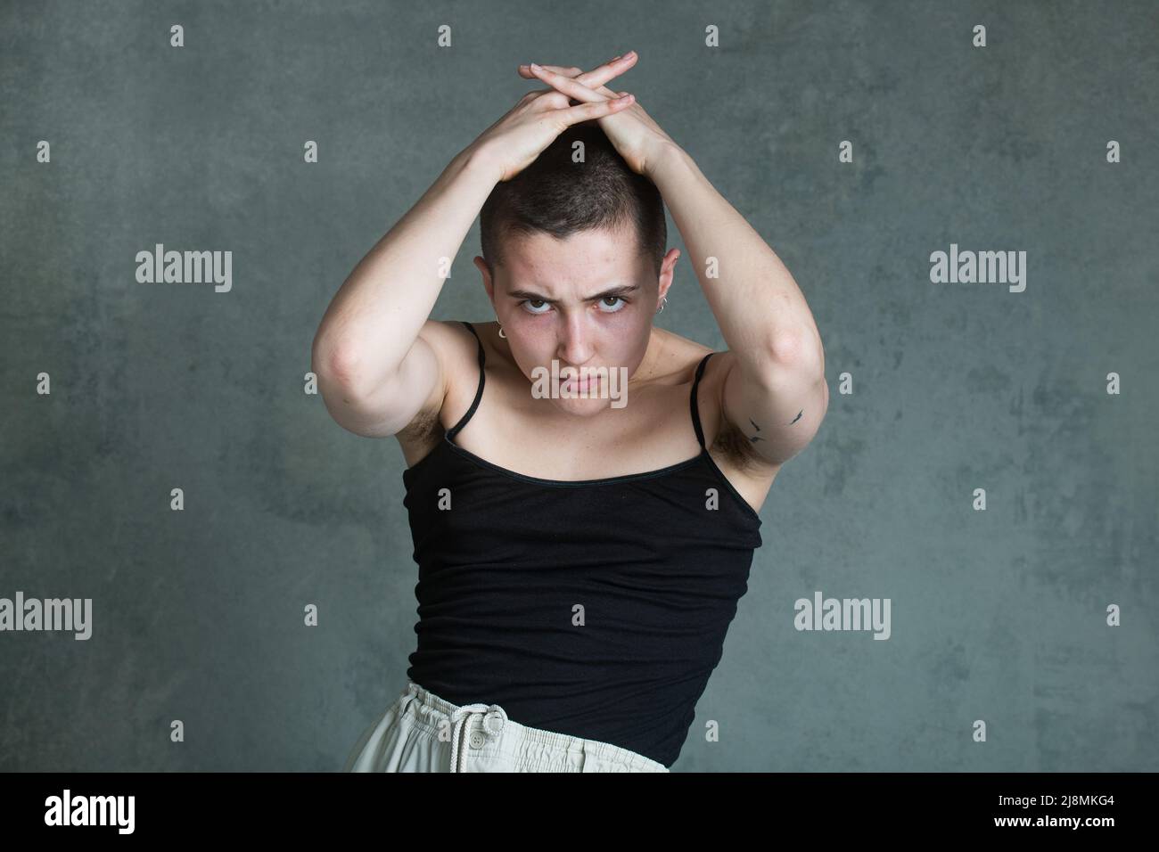 non binary pulling an angry, frustrated face Stock Photo - Alamy