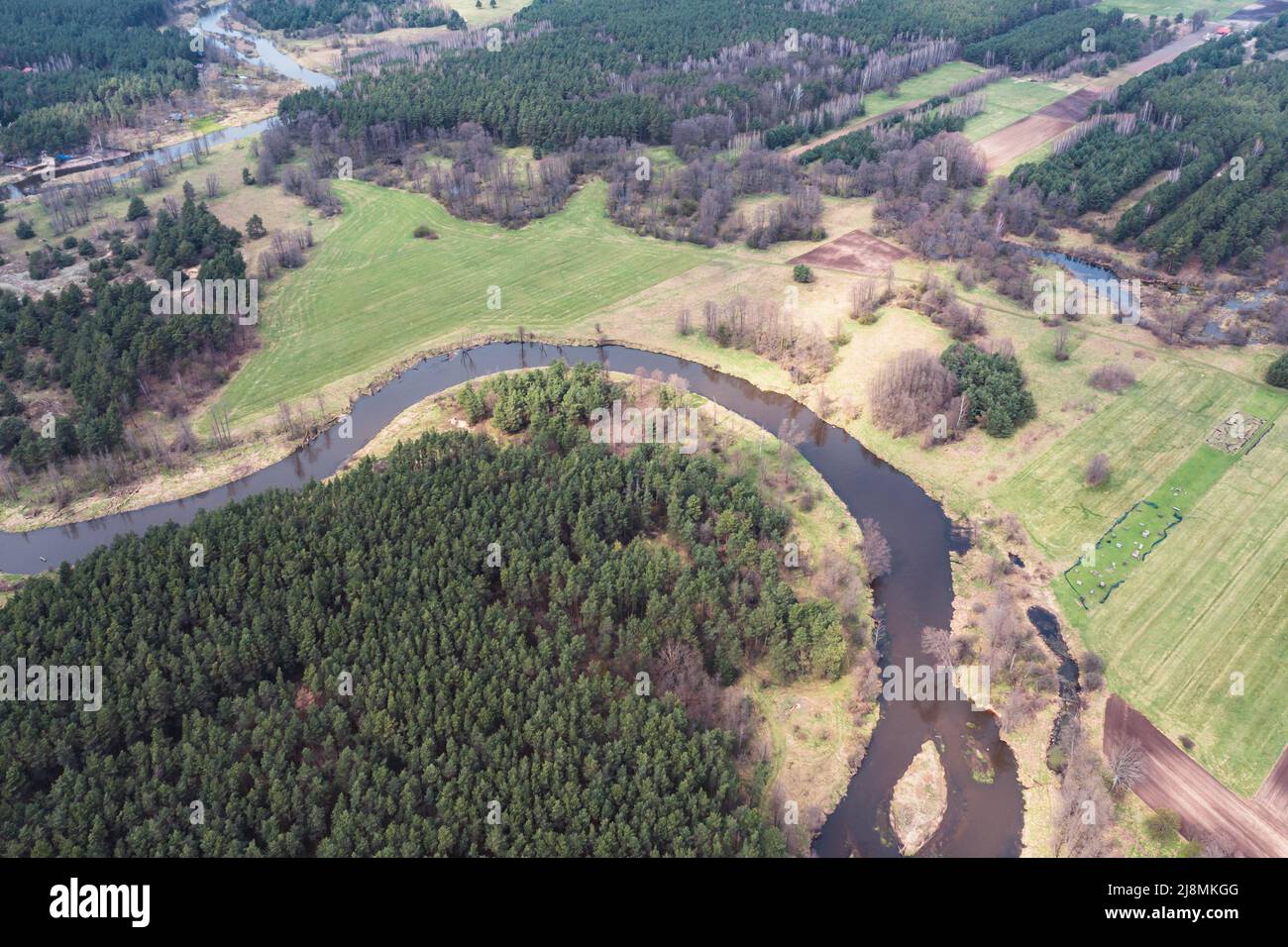 Aerial view of Liwiec River and fields near Starowola village in ...