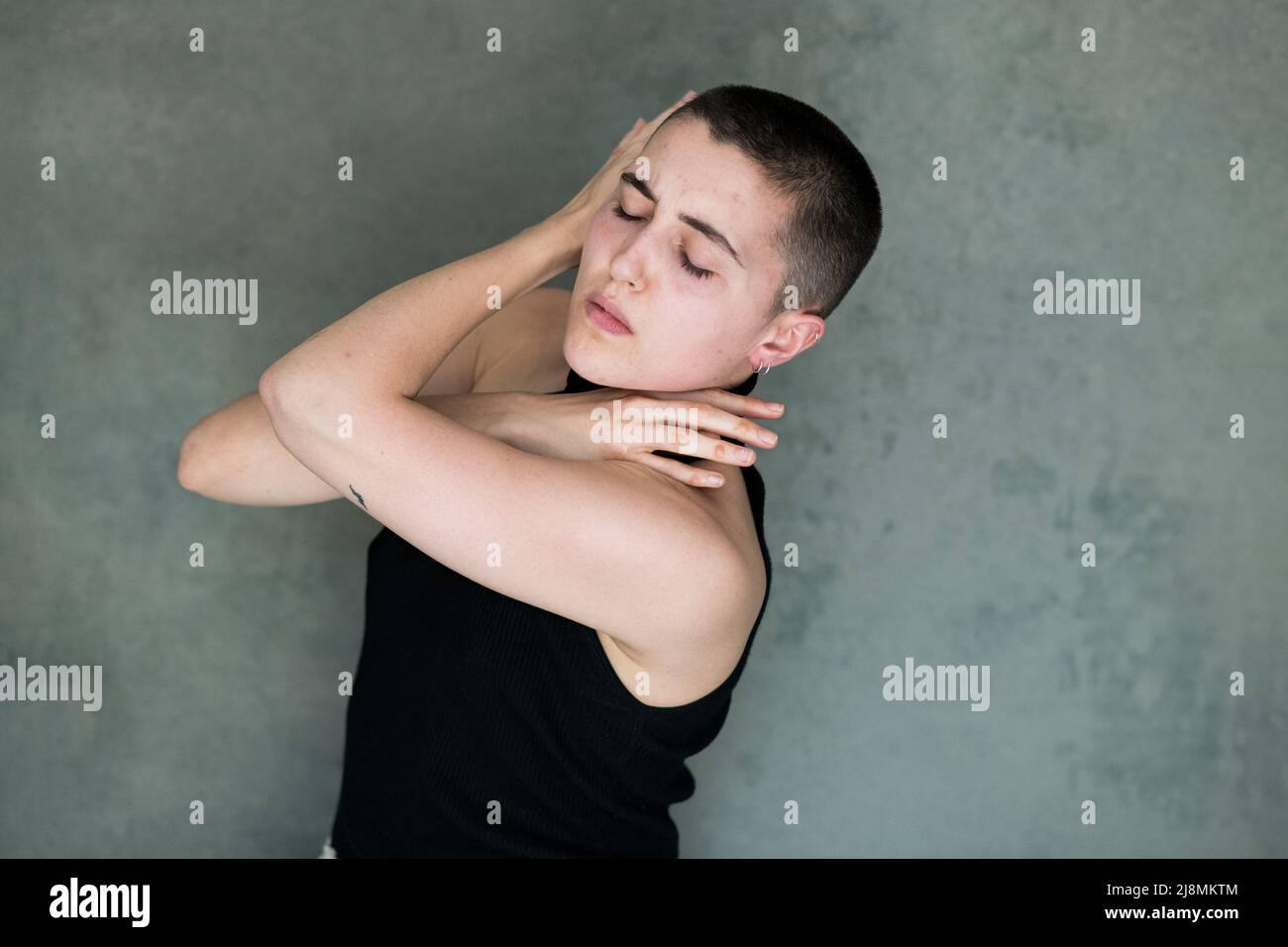 non binary pulling an angry, frustrated face Stock Photo - Alamy